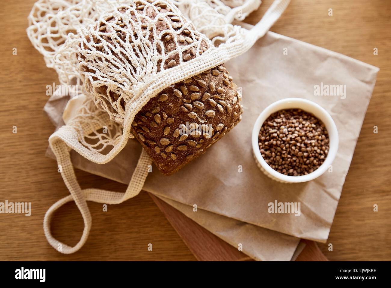 Fresh buckwheat unleavened bread with sunflower seeds in eco mesh ...
