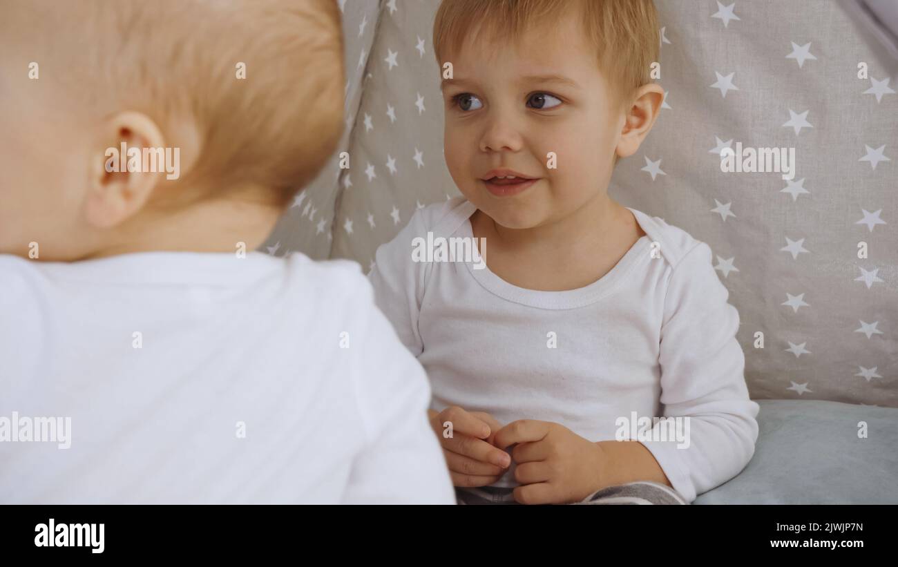 cute toddler siblings playing together in baby wigwam Stock Photo - Alamy