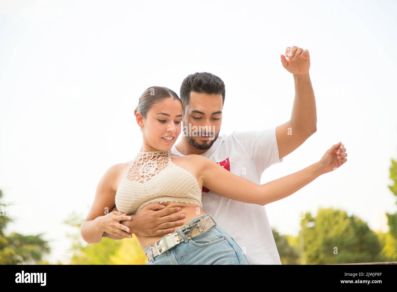 Casual dancing couple practising salsa in the street Stock Photo - Alamy