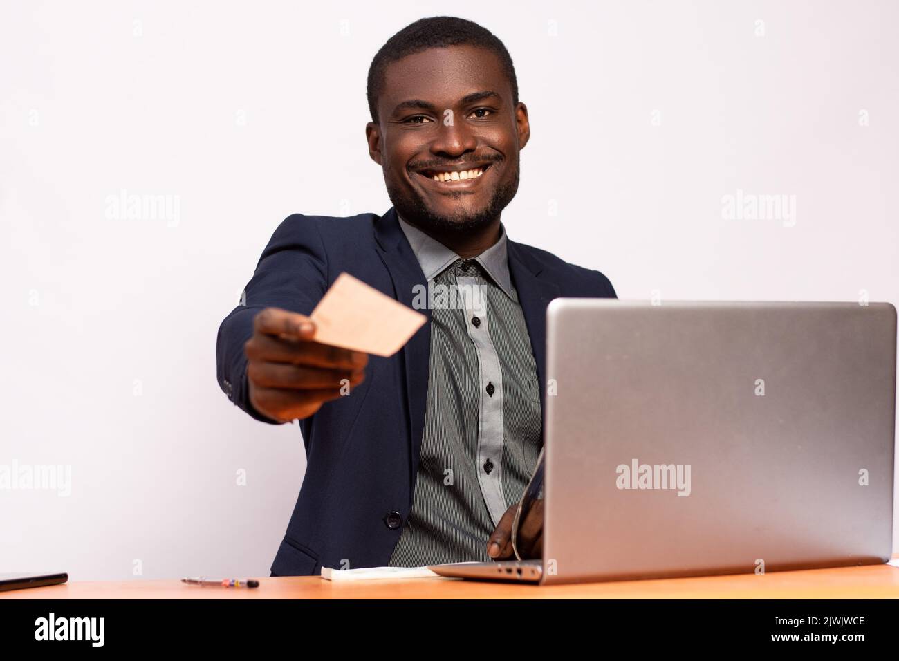 african businessman giving someone a check Stock Photo - Alamy