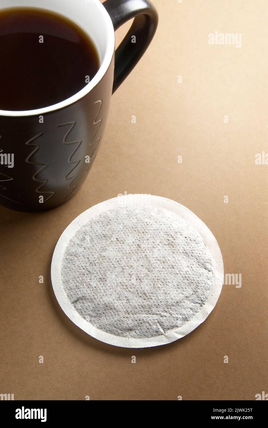 Fresh coffee bag with a mug of black coffee Stock Photo - Alamy