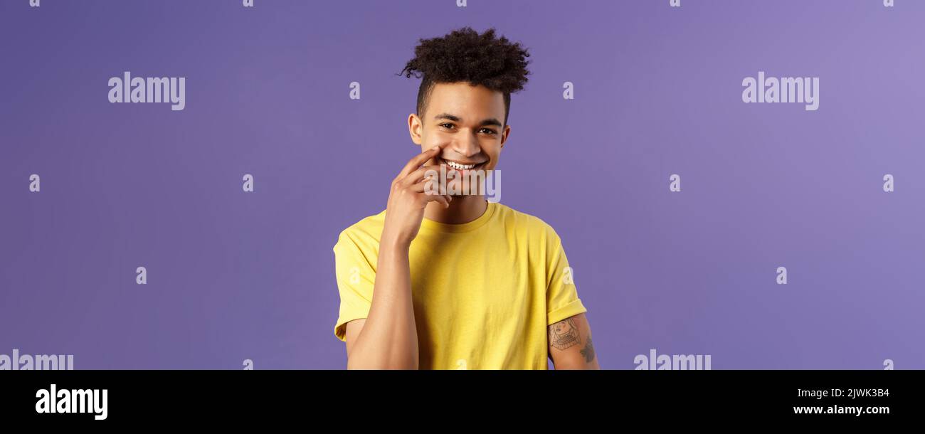 Close Up Portrait Of Lovely Young Hispanic Gay Man With Dreads Tattoos Touching Lip Sensually