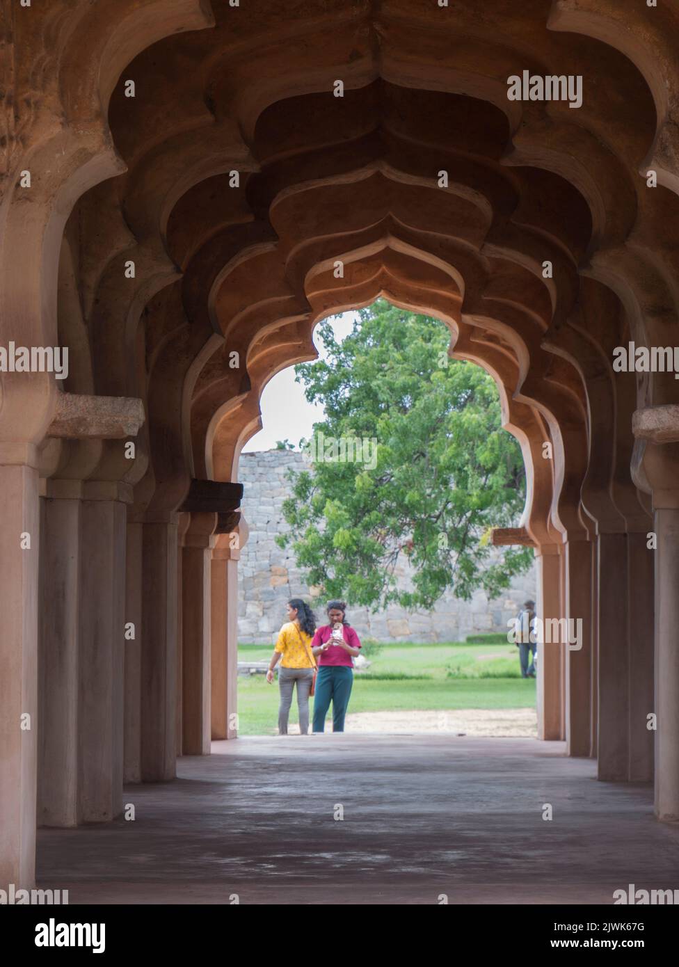 Decorative arches of Lotus Mahal a two-storeyed pavilion at Hampi state ...