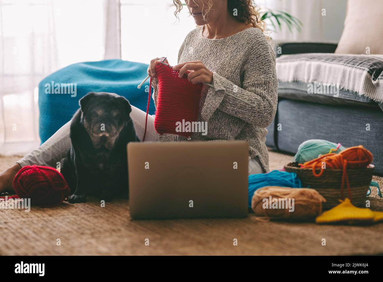 Domestic real life scene with woman in indoor leisure activity doing ...