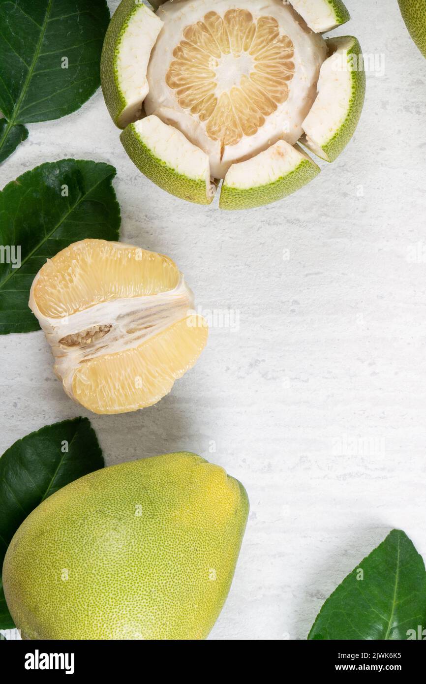 Top view of fresh peeled pomelo on white table background for Mid ...