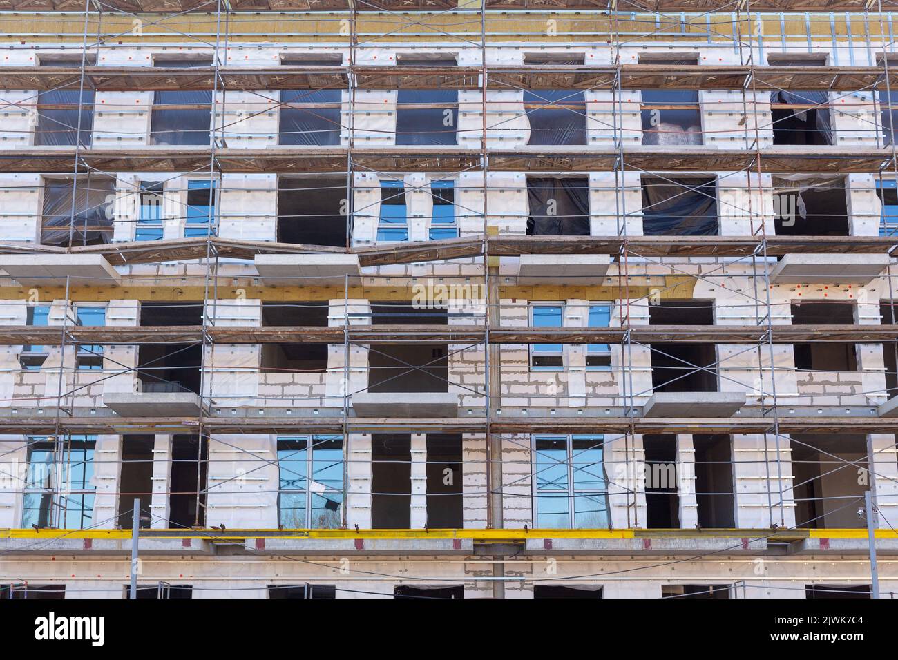 Insulation of the exterior walls of a building under construction. The ...