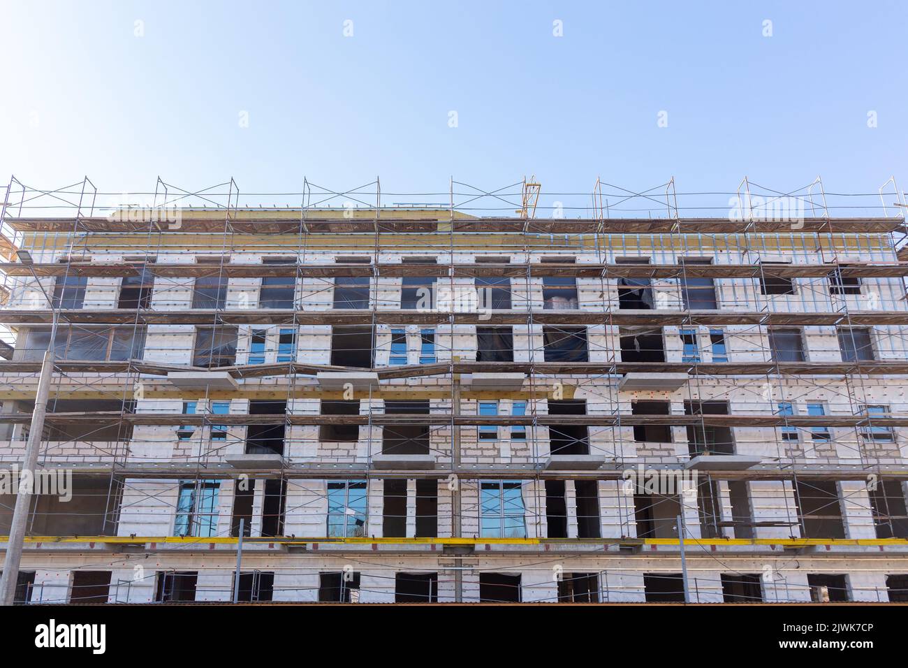 Insulation of the exterior walls of a building under construction. The ...