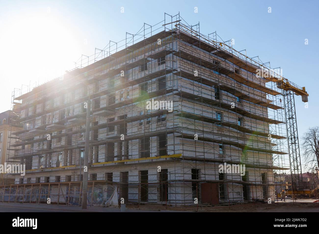 Insulation of the exterior walls of a building under construction. The ...