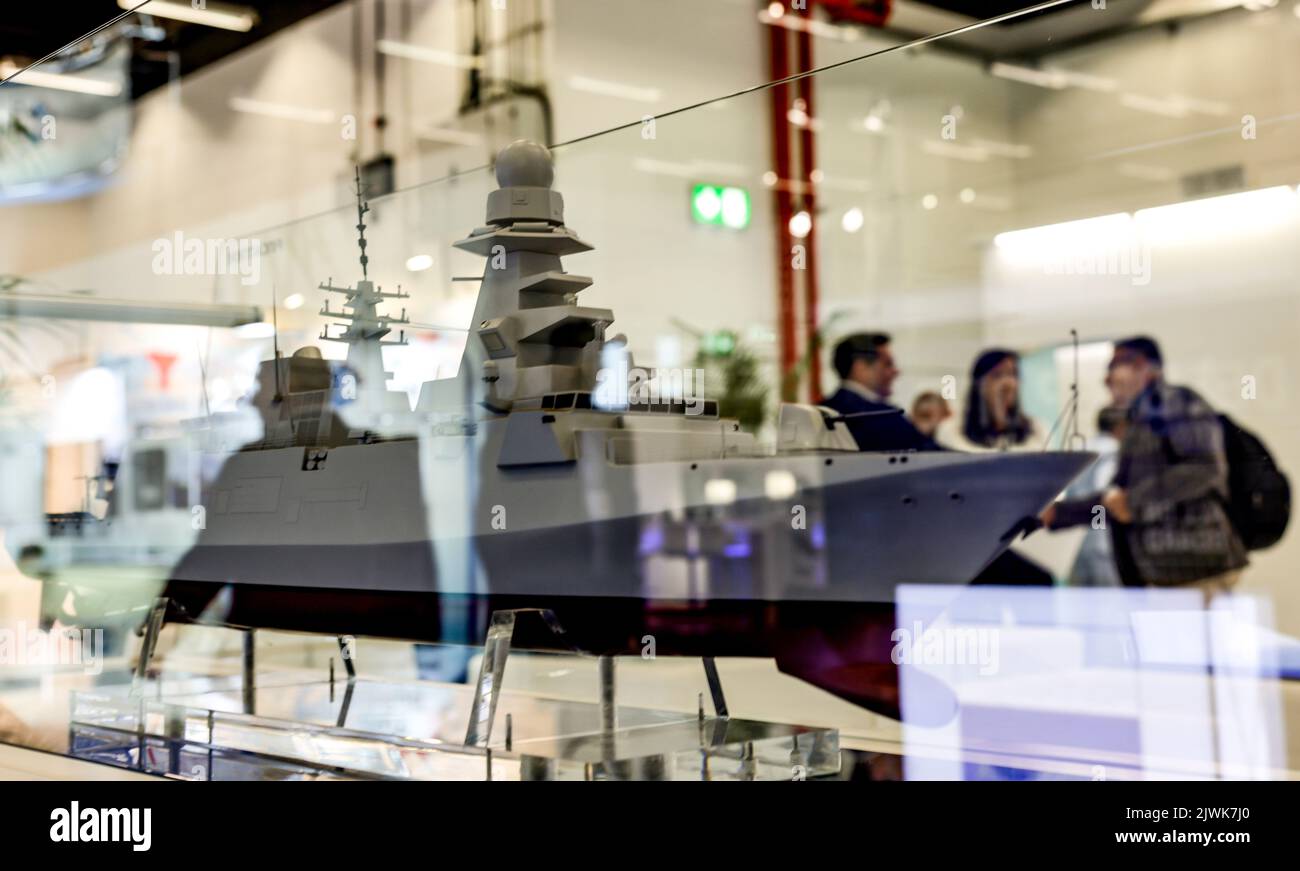 Hamburg, Germany. 06th Sep, 2022. Visitors walk behind a model of a ...