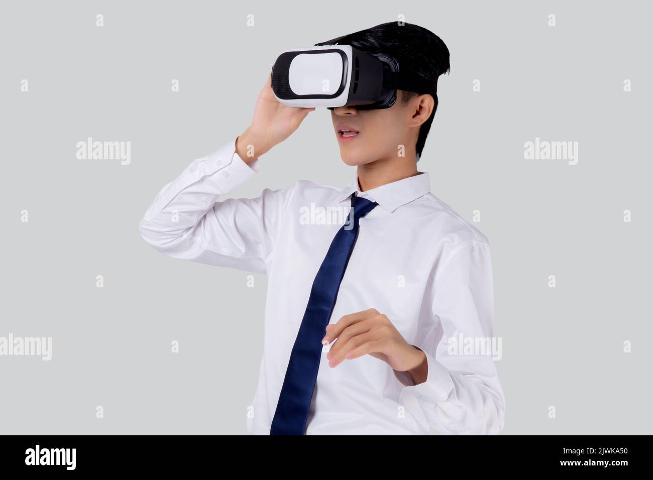 Experience of young asian businessman wearing VR Headset with excited isolated on white ...