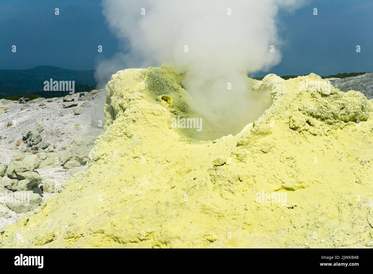 cone of sulfur deposits around a fumarole in a solfataric field ...