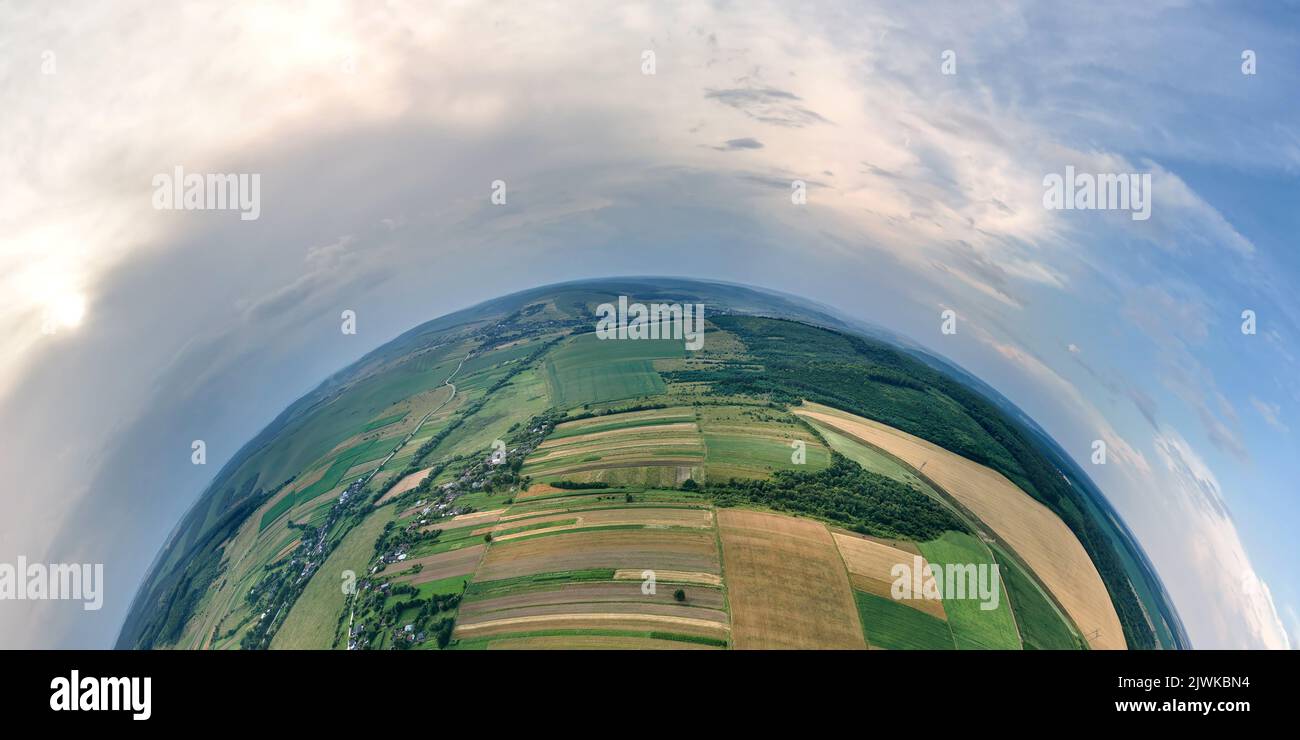 Aerial view from high altitude of little planet earth with green and ...