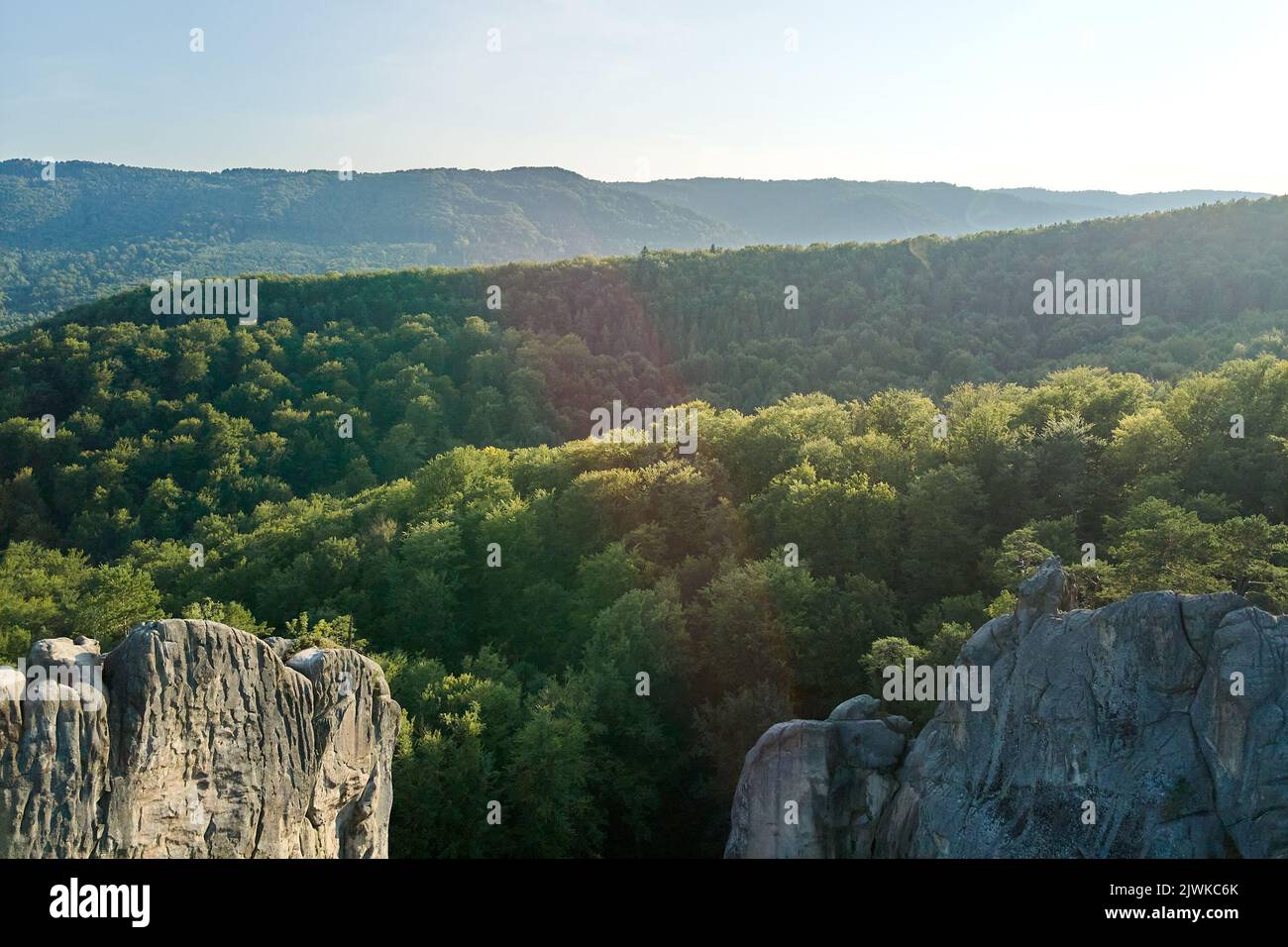 Aerial view of bright landscape with green forest trees and big rocky ...