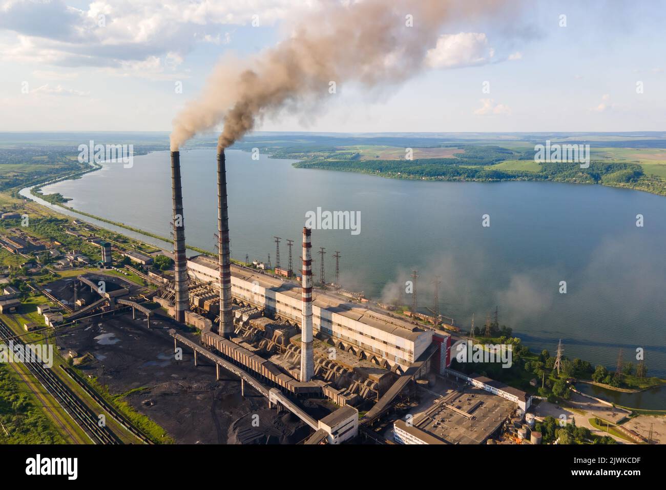 Aerial view of coal power plant high pipes with black smokestack ...