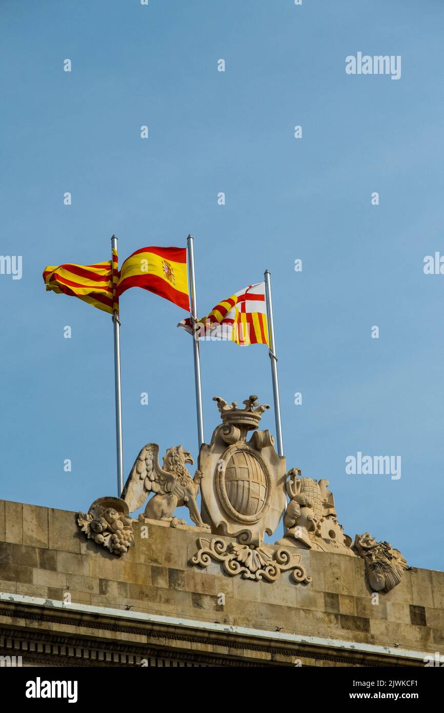 View of the flags of Barcelona, Catalonia and Spain flutter in the wind ...