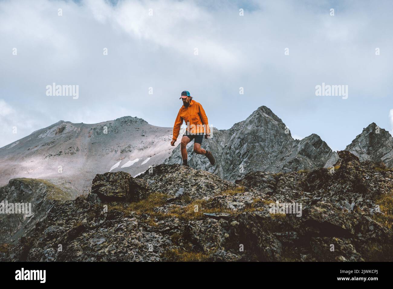 Man trail running in mountains outdoor activity extreme vacations ...