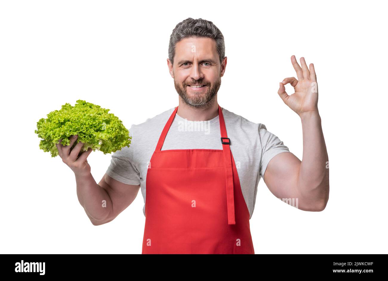 man in apron with lettuce vegetable isolated on white. ok Stock Photo ...