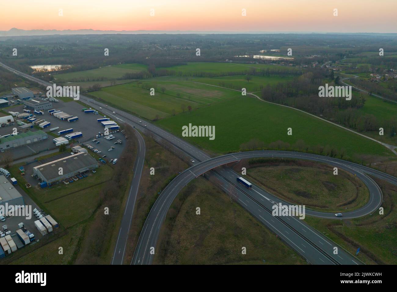 Aerial view of highway road intersection with fast moving heavy traffic ...