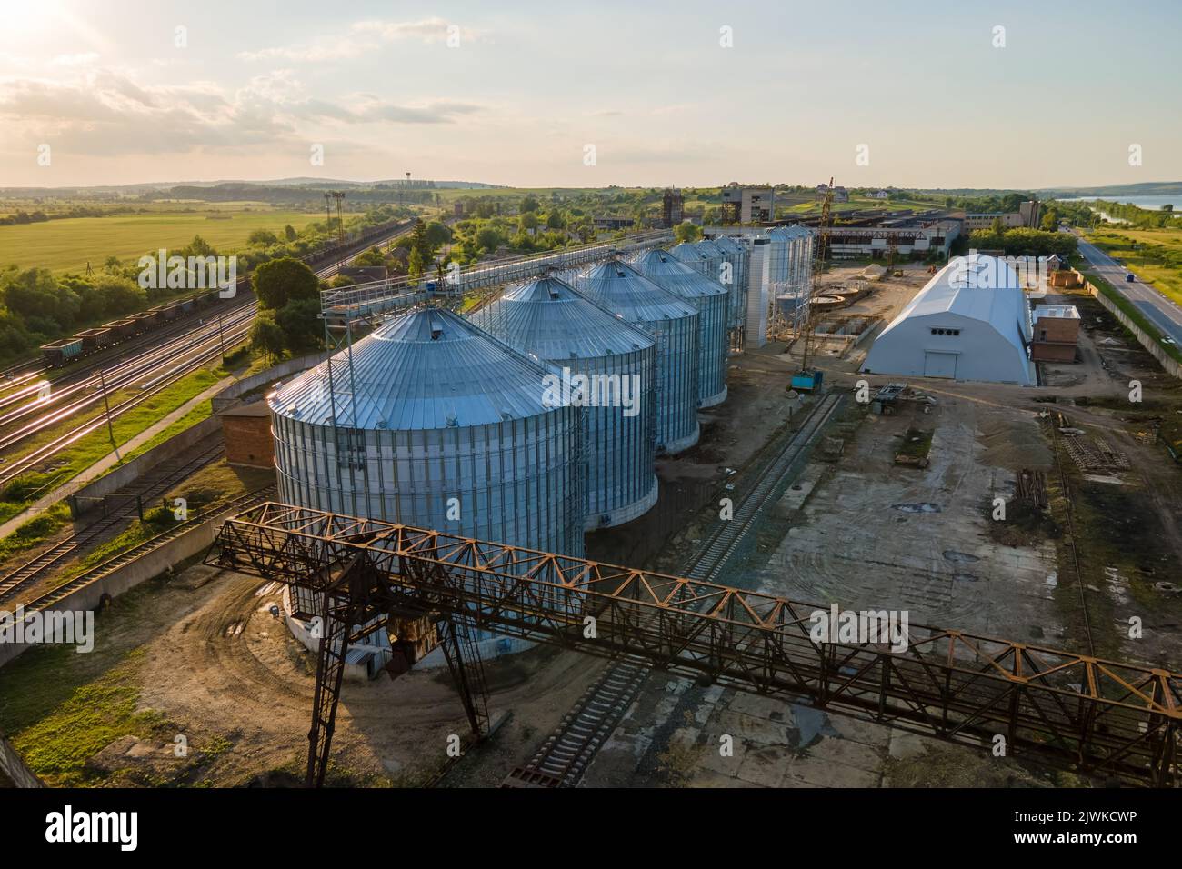 Aerial view of industrial ventilated silos for long term storage of grain and oilseed. Metal ...
