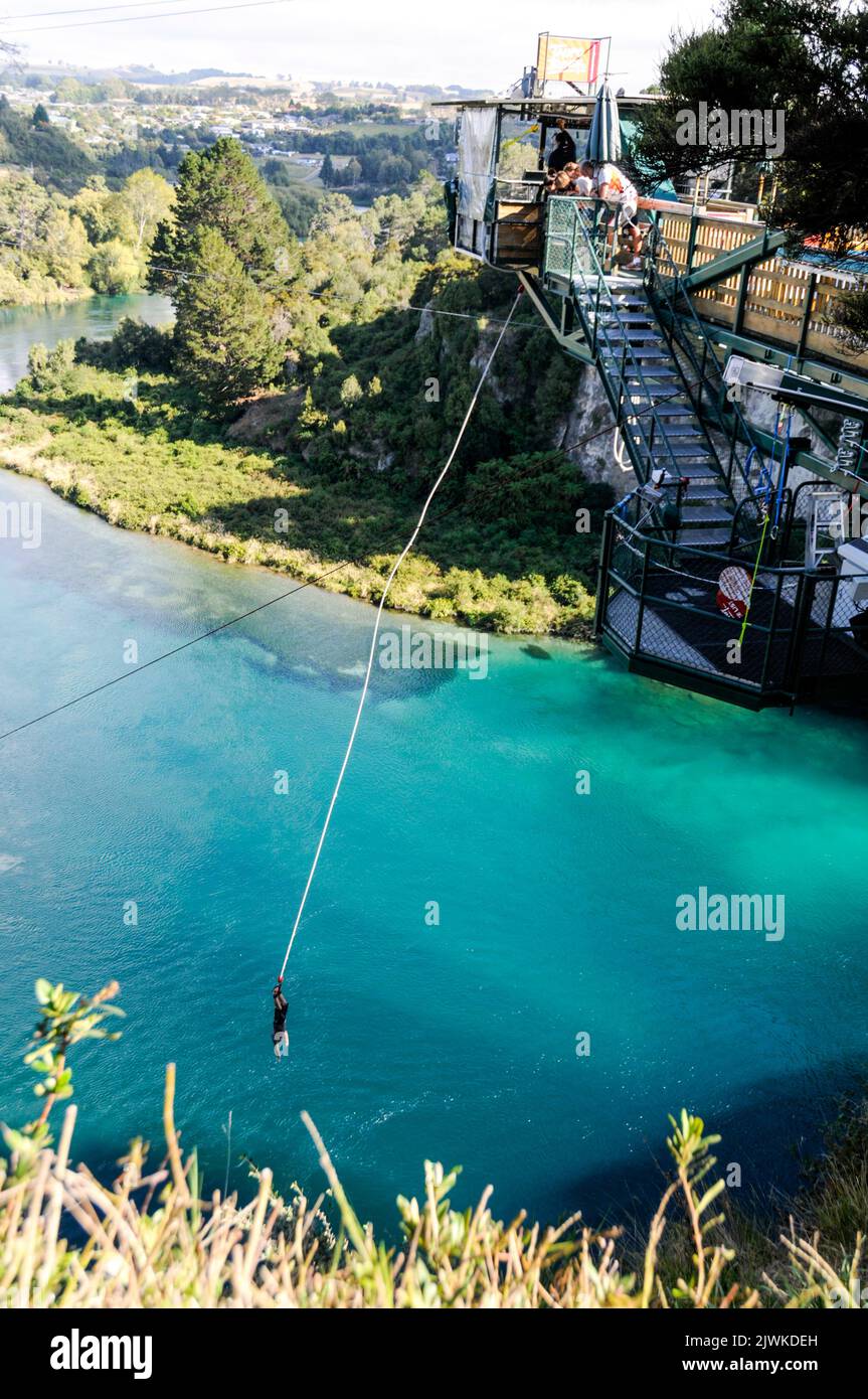 A bungy jumper connected with an elastic cord, plunges 47 metres below ...