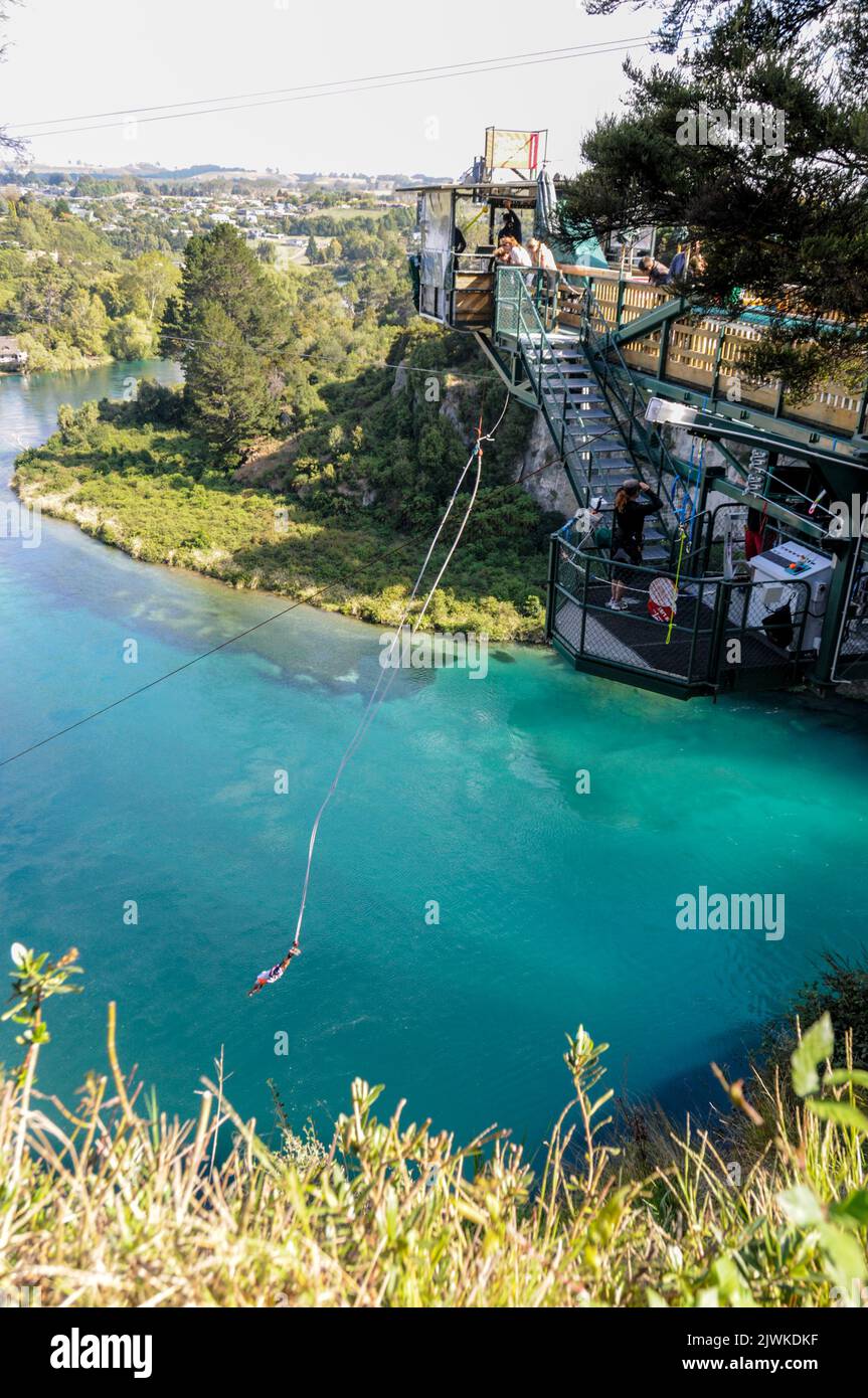A bungy jumper connected with an elastic cord, plunges 47 metres below ...