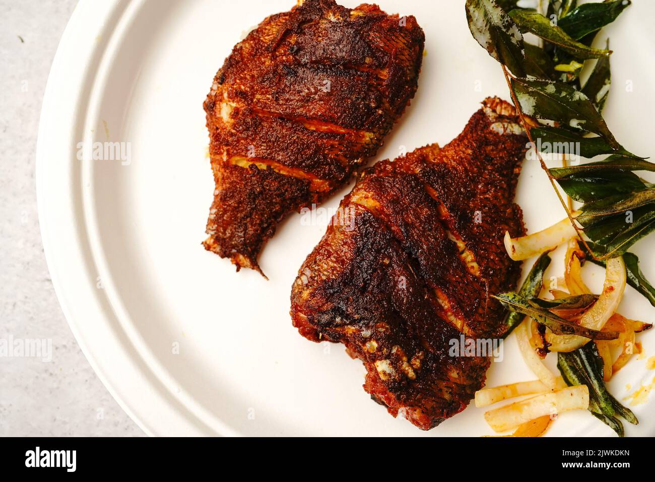 Masala coated Kerala fish fry, selective focus Stock Photo - Alamy
