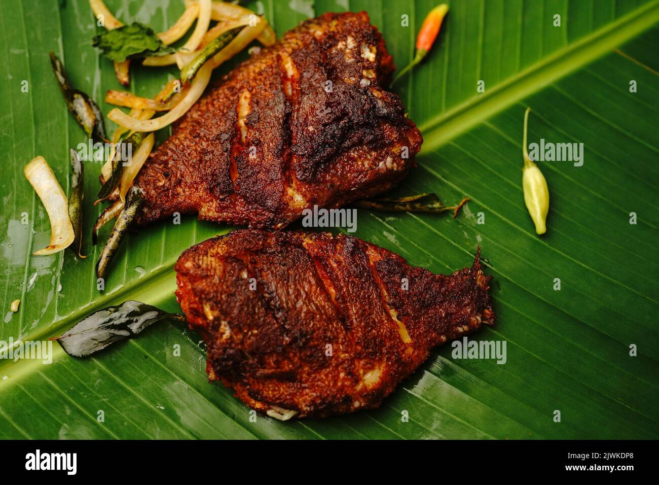 Masala coated Kerala fish fry, selective focus Stock Photo - Alamy
