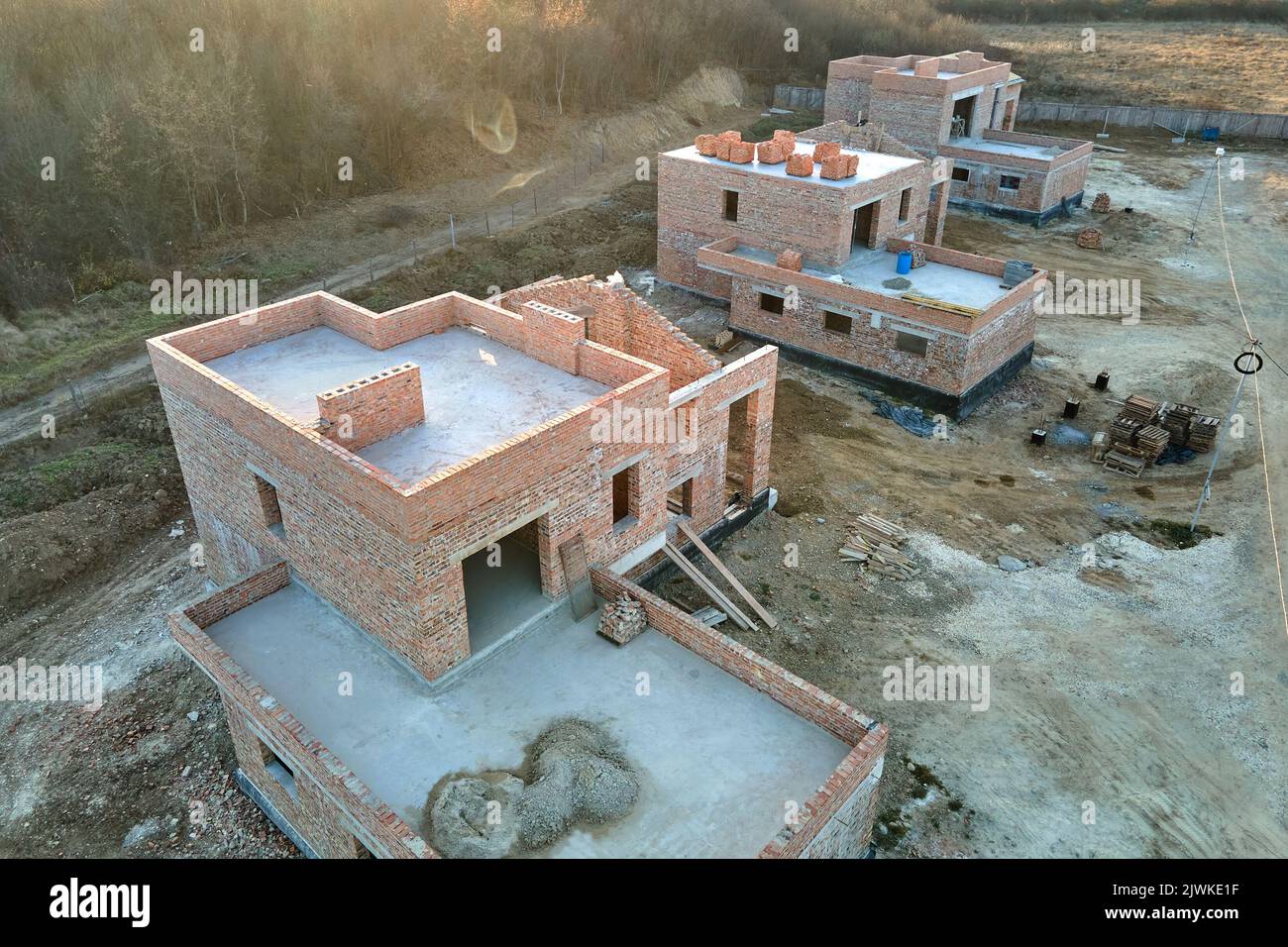Aerial view of new homes with brick framework walls under construction ...