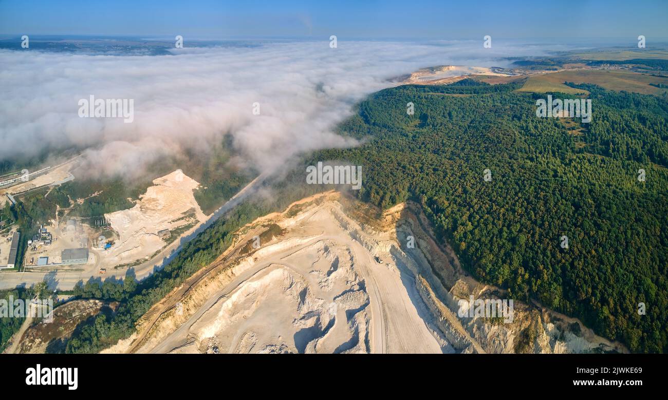 Aerial view of open pit mining of limestone materials for construction ...