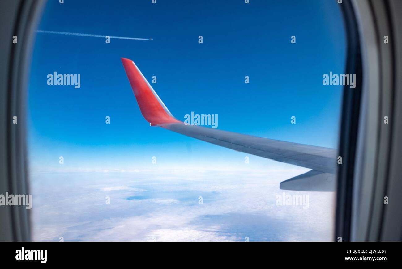 View of the wing and the plane flying parallel to the course from the ...