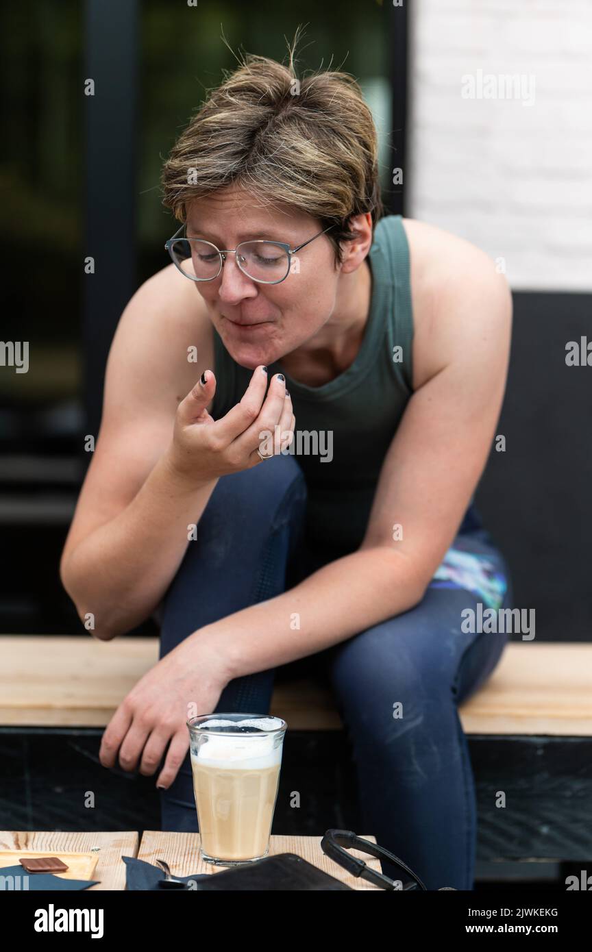 36 year old white woman enjoying a cafe latte and sweets, Brussels ...