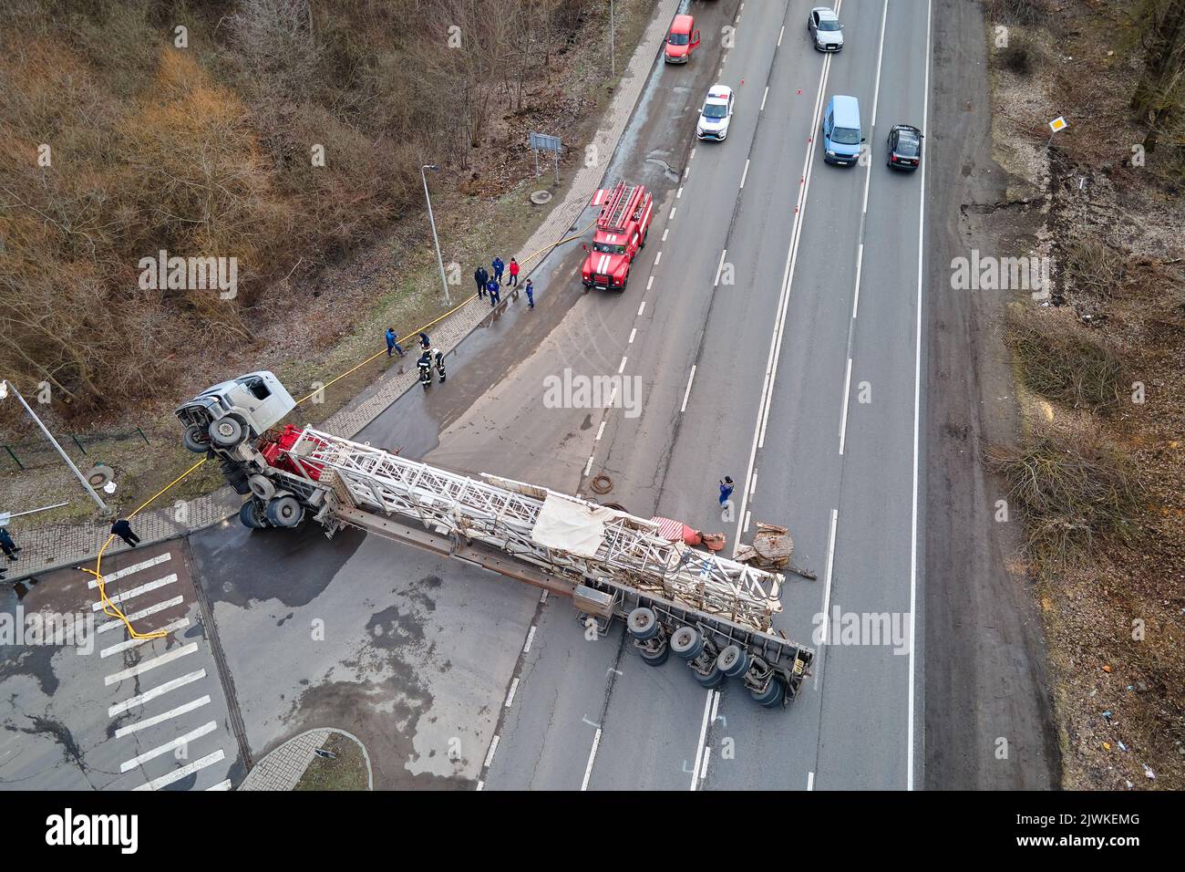 Aerial view of road accident with overturned truck blocking traffic ...