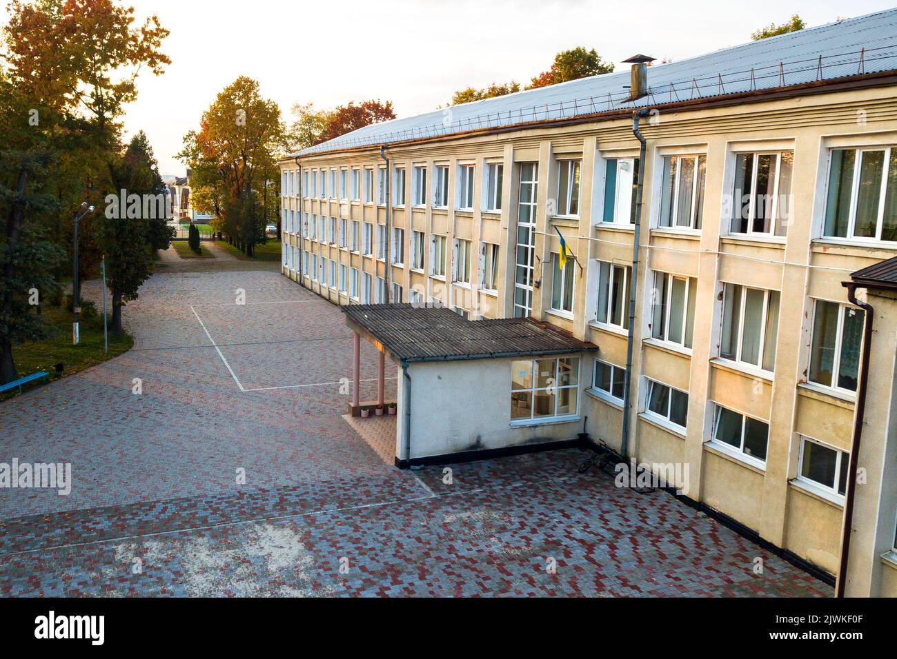 Aerial view of school, college or kindergarten building with big yard ...