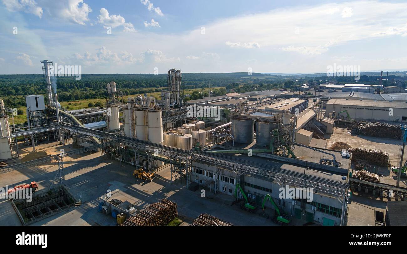 Aerial view of wood processing factory with stacks of lumber at plant ...