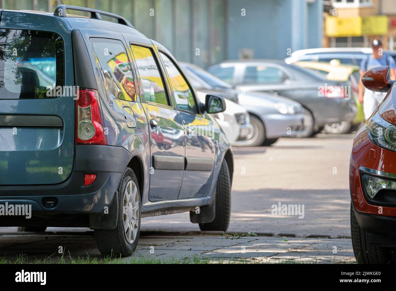 Cars parked in line on city street side. Urban traffic concept Stock ...