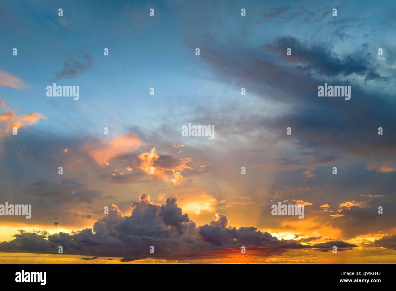 Colorful evening landscape with soft pastel coloured clouds on ...