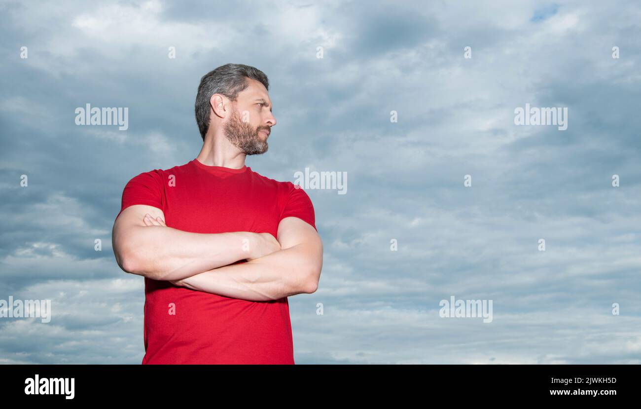 Confident man sky background. Serious man keeping arms crossed Stock ...