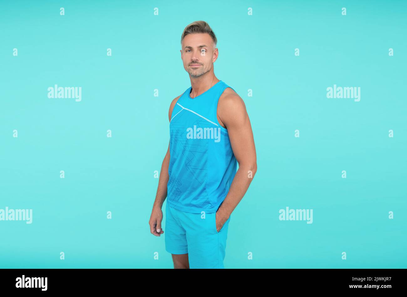 fitness sportsman blue background. Sportsman in fitness sportswear ...