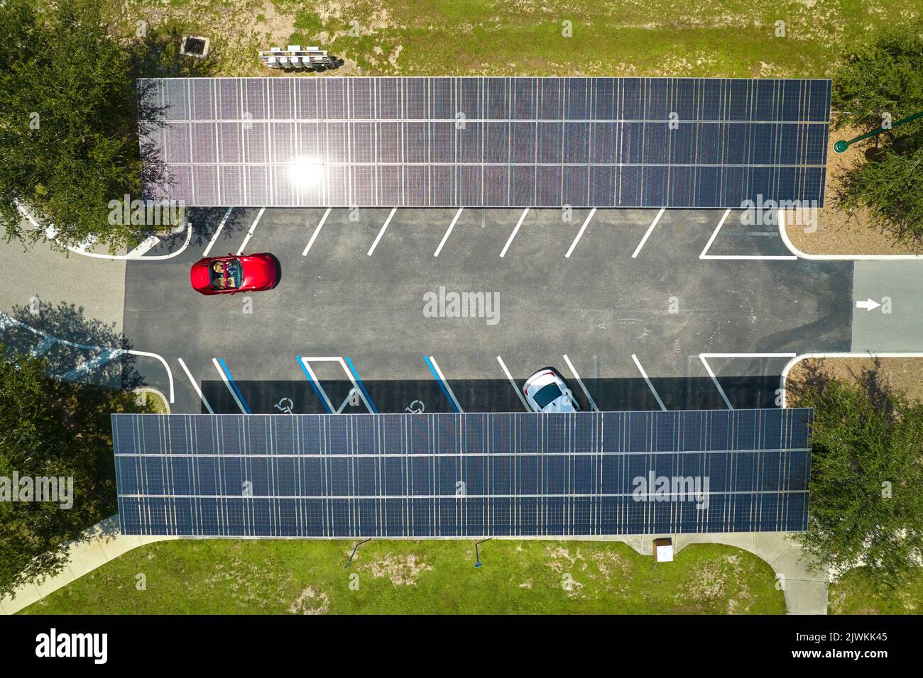 Solar panels installed over parking lot for parked cars for effective ...