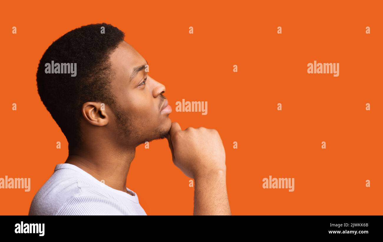 Profile Portrait Of Thoughtful Black Man Thinking On Orange Background ...