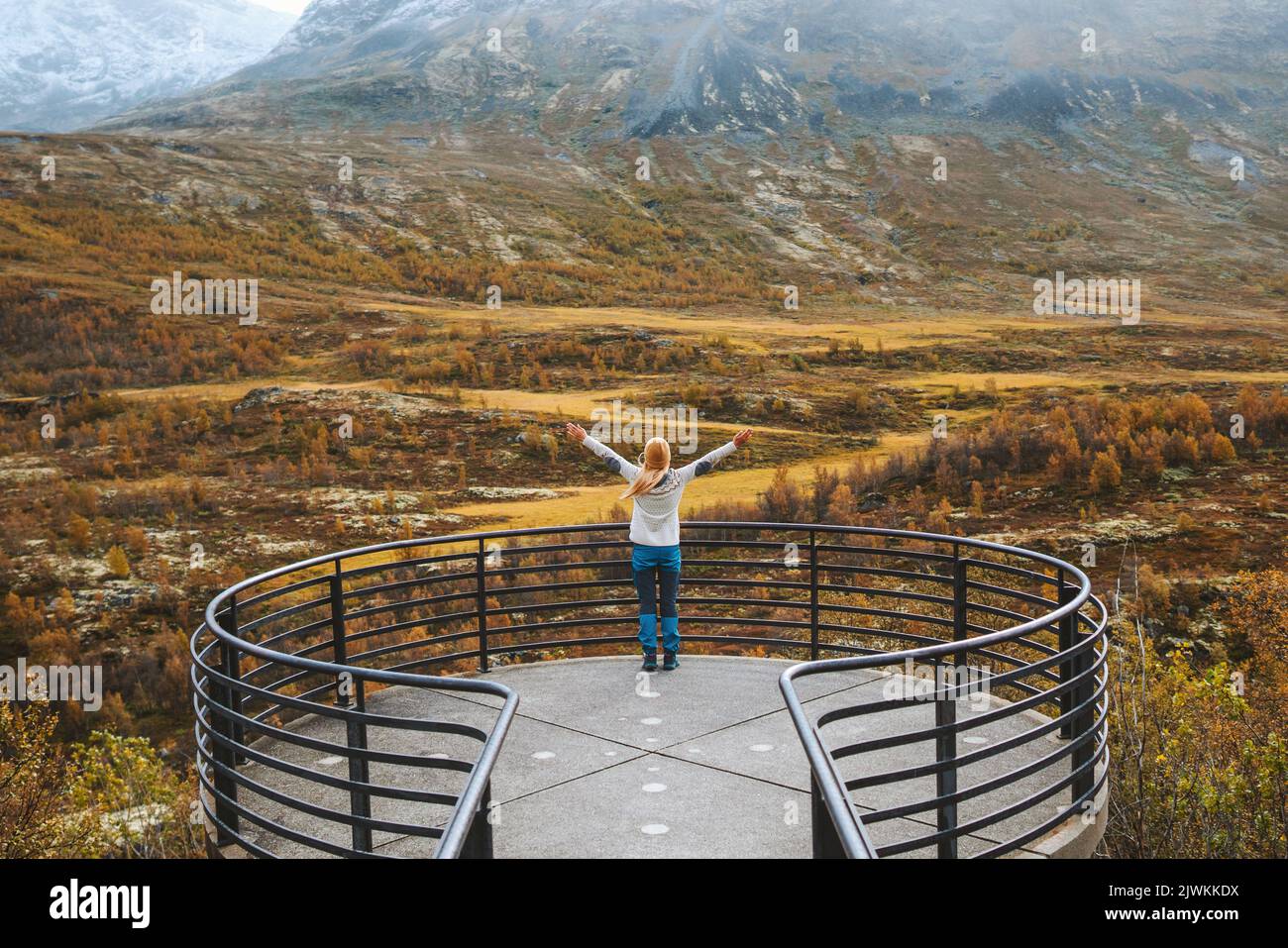 Autumn in Norway adventure travel outdoor woman raised hands on ...