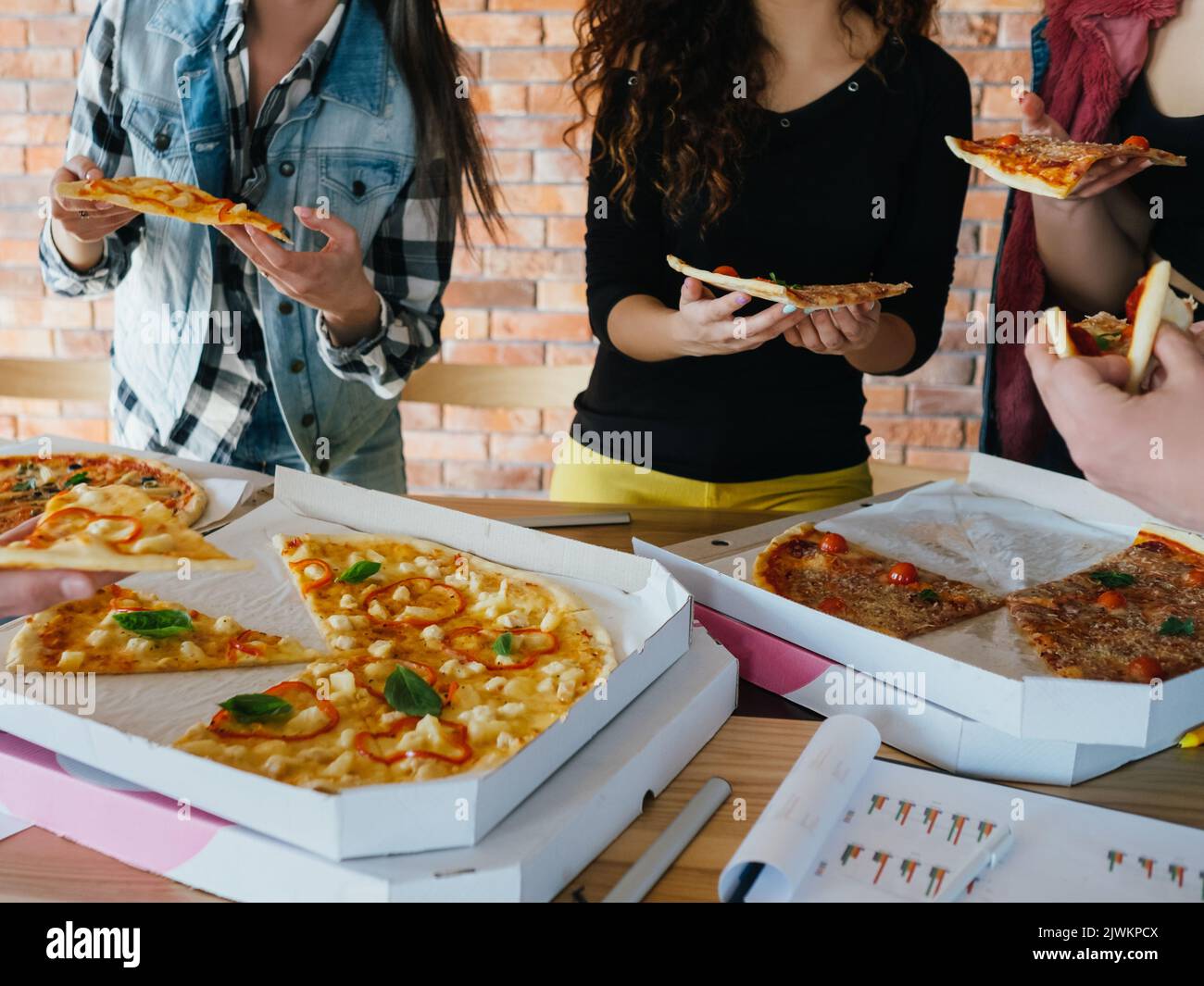 pizza business team lunch unhealthy delicious meal Stock Photo - Alamy