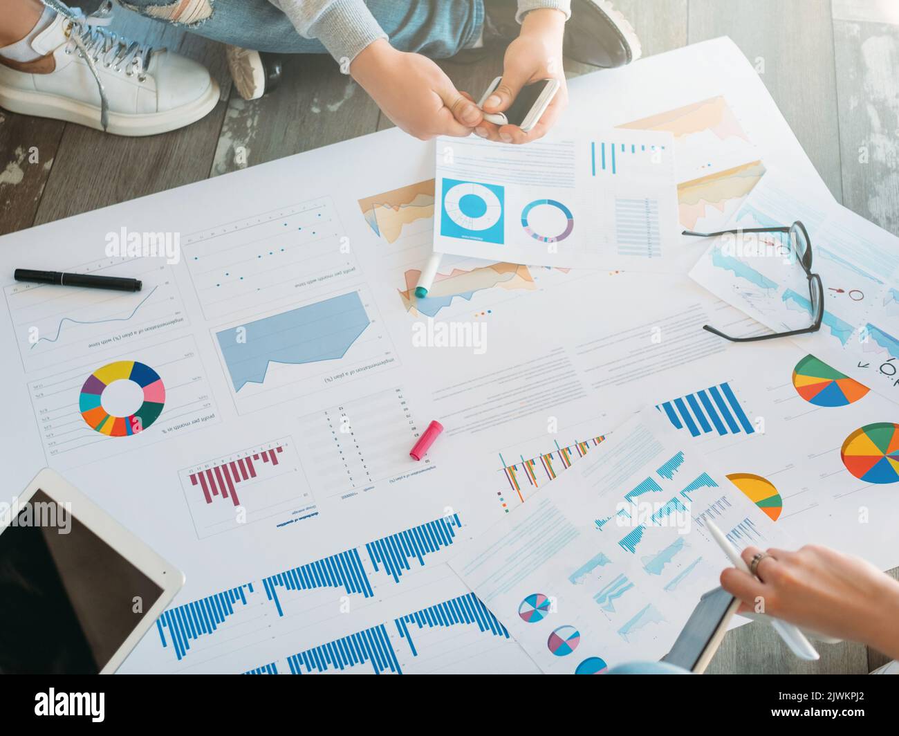 millennials teamwork graphs startup project Stock Photo - Alamy