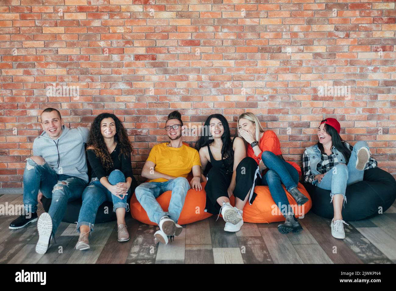 millennials chilling out leisure zone laughing Stock Photo - Alamy