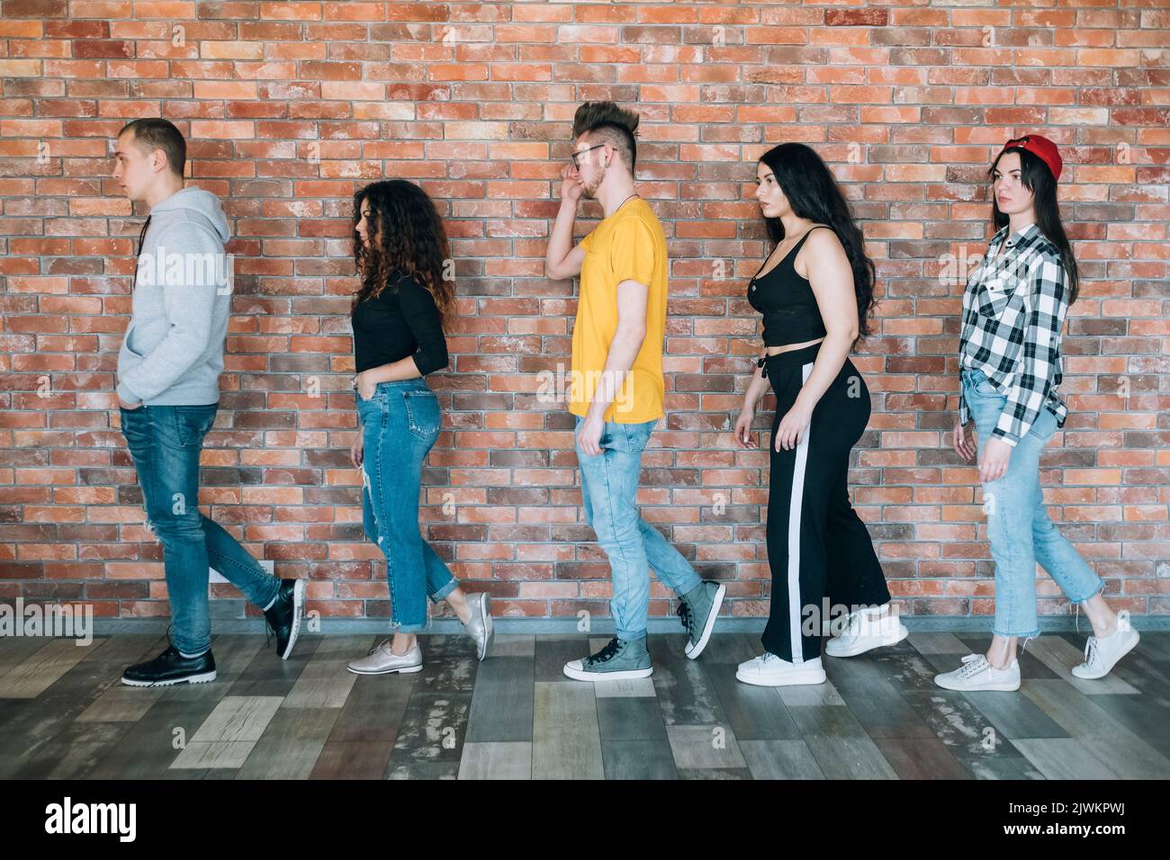 queue millennial standing waiting people diversity Stock Photo - Alamy