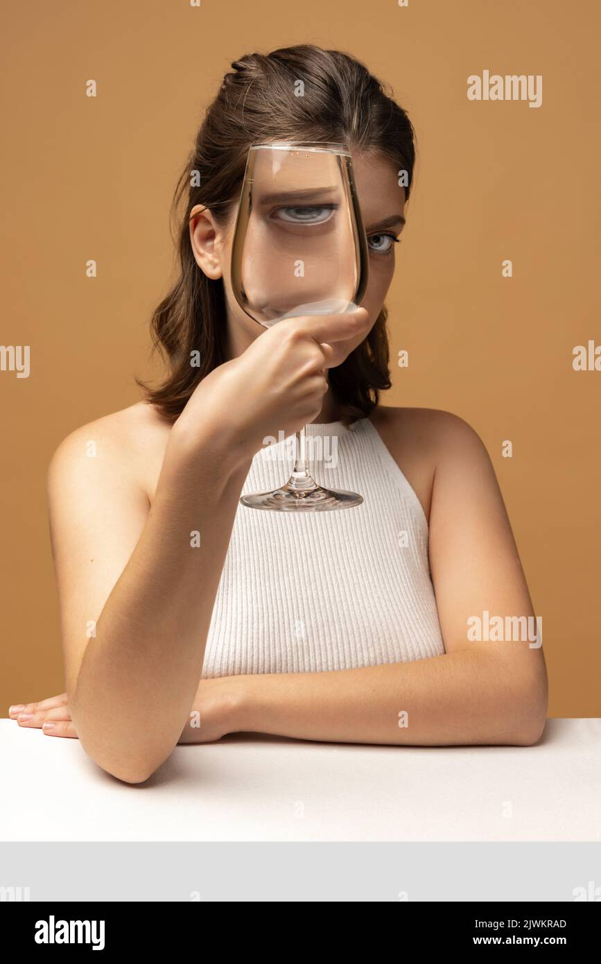 Creative art photography. Stylish girl's face through wine glass over ...
