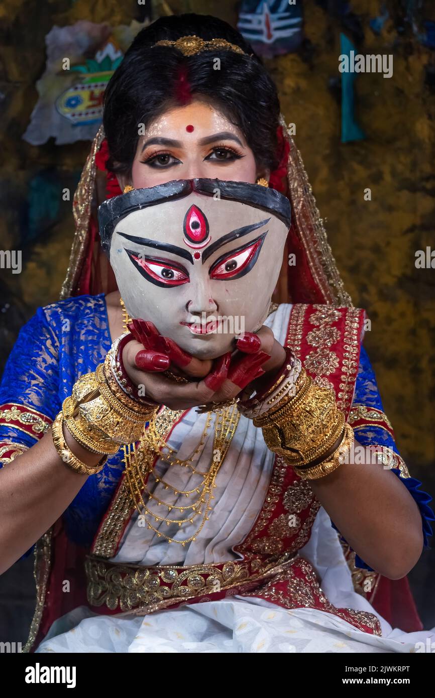 Agomoni concept photo shoot, A poses for the camera with an unfinished ...