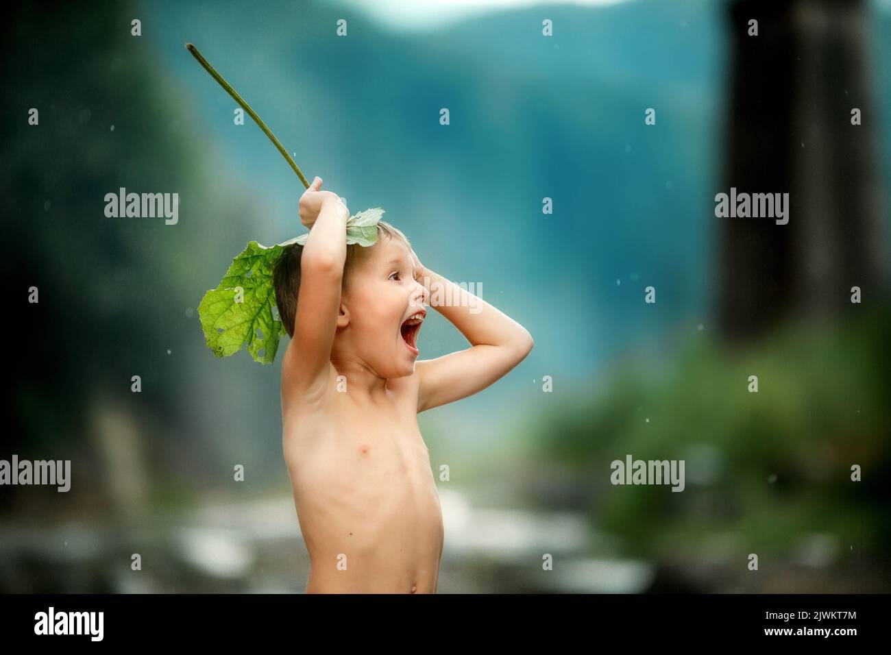 Boy hiding from rain hi-res stock photography and images - Alamy