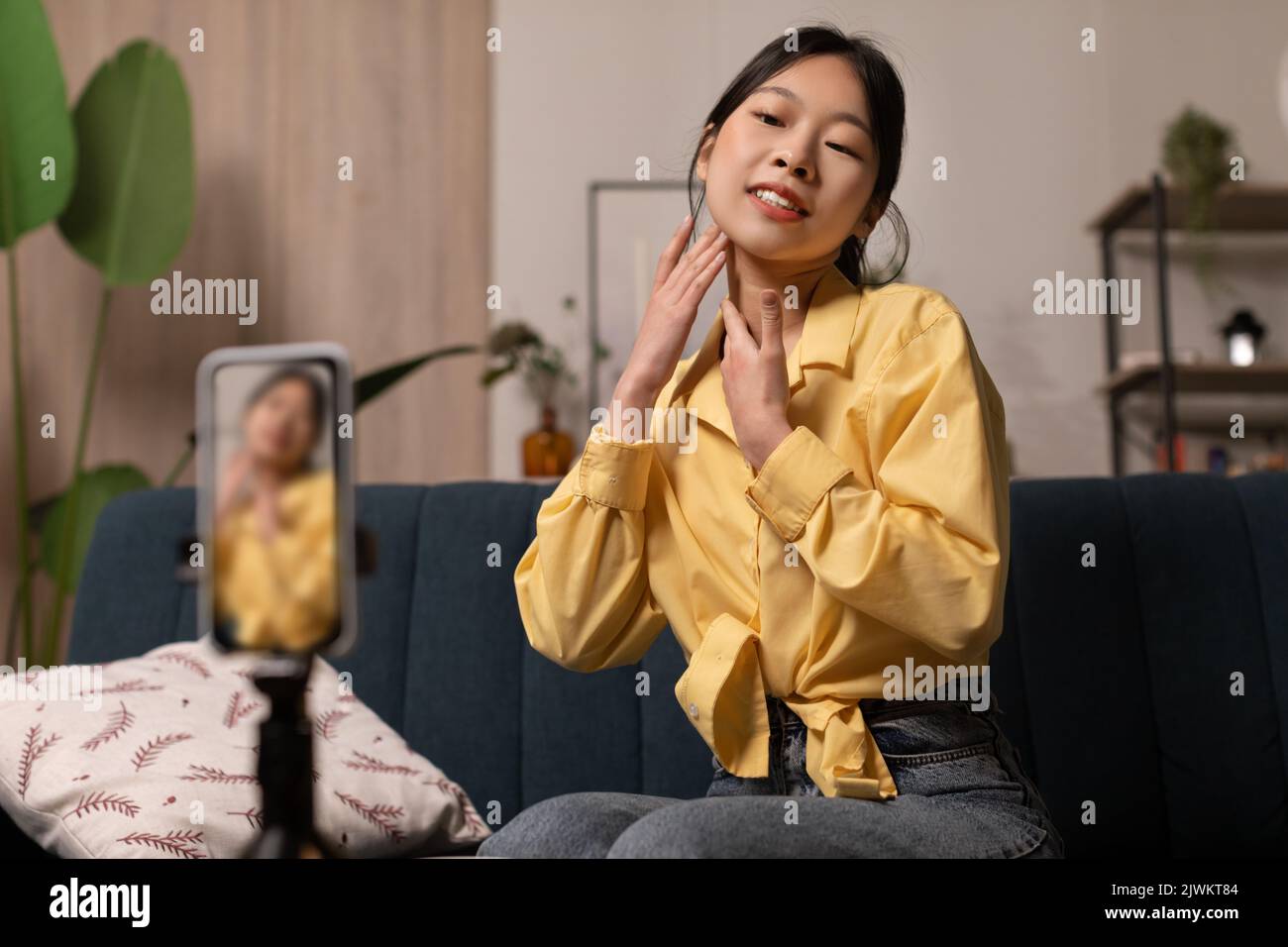 Asian Beauty Blogger Woman Making Facial Massage Creating Video Indoor ...