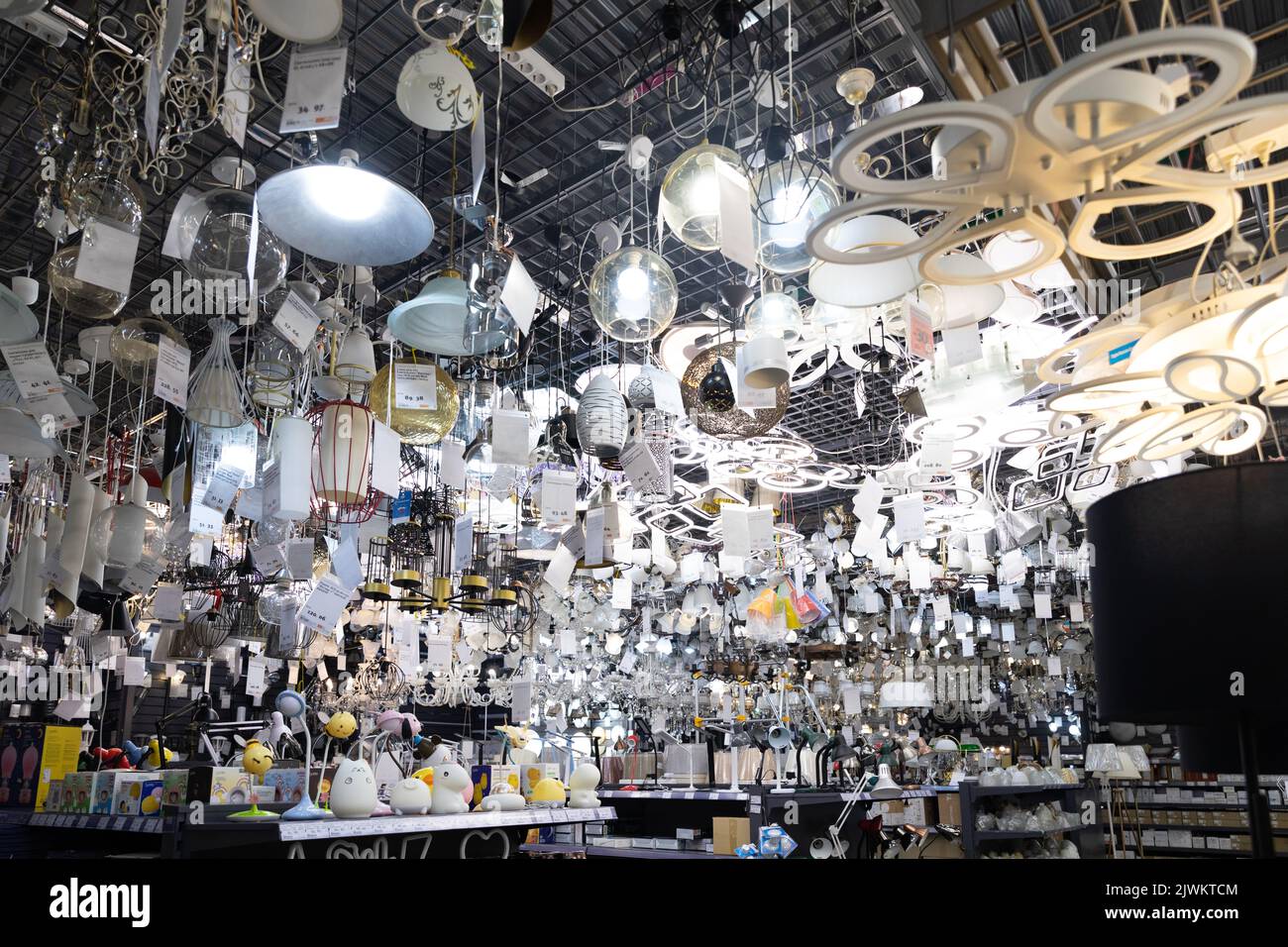 Woman lamp bulb shop hi-res stock photography and images - Alamy